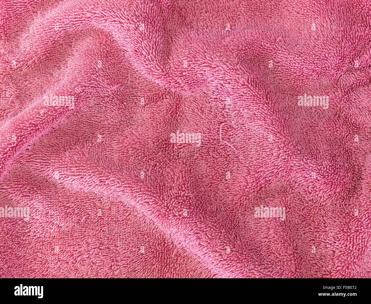 A studio photo of a pink bath towel Stock Photo - Alamy