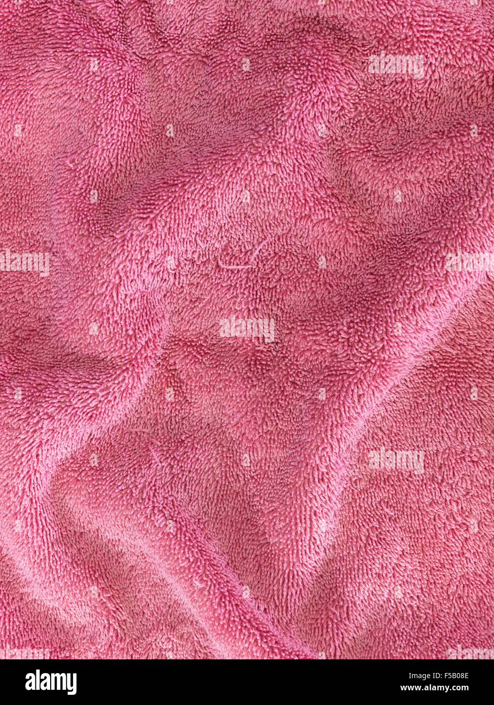 A studio photo of a pink bath towel Stock Photo - Alamy