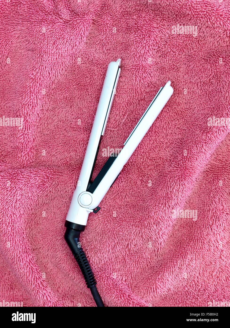 A studio photo of a hair straightener Stock Photo - Alamy