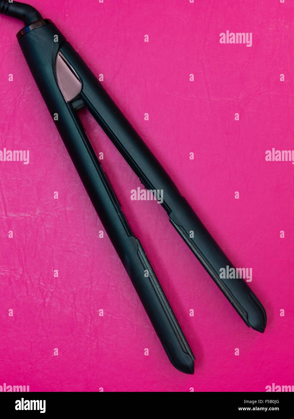 A studio photo of a hair straightener Stock Photo - Alamy