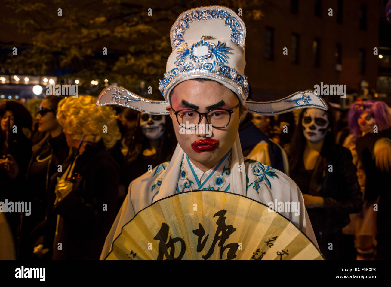 New York, NY - 31 October 2015. An Asian man ornately costumed and made ...