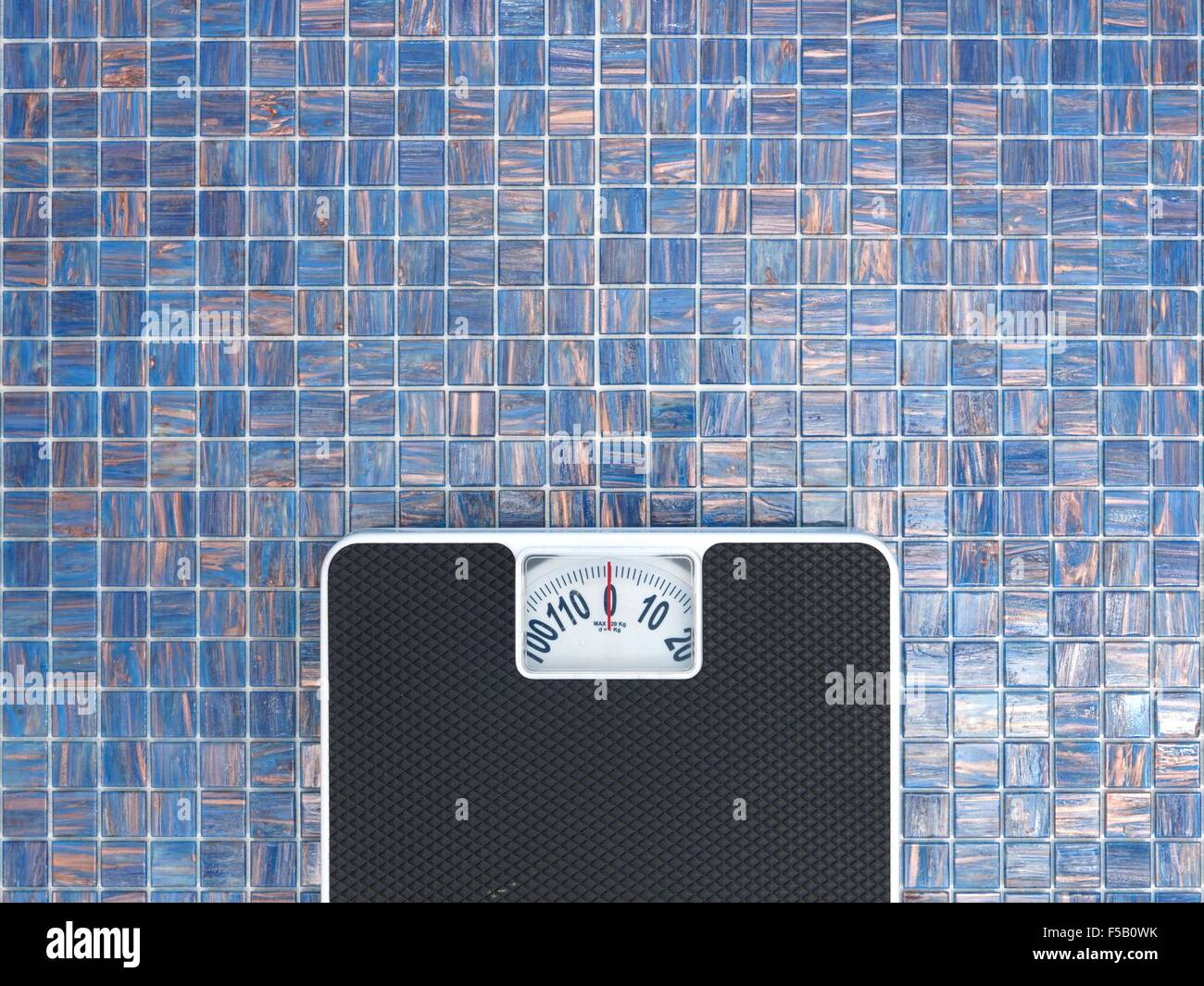 A studio photo of a set of body scales on tiles Stock Photo - Alamy