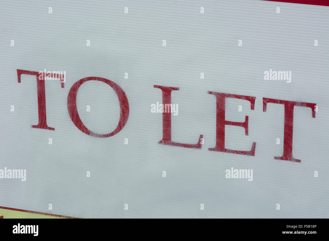 Simple estate agent's 'To Let' sign in a window Stock Photo - Alamy