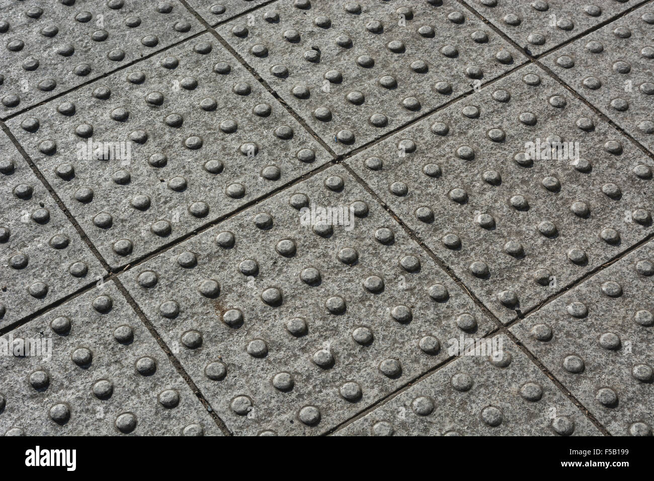 Square granite pavement segments in Cambourne, Cornwall. Metaphor high ...