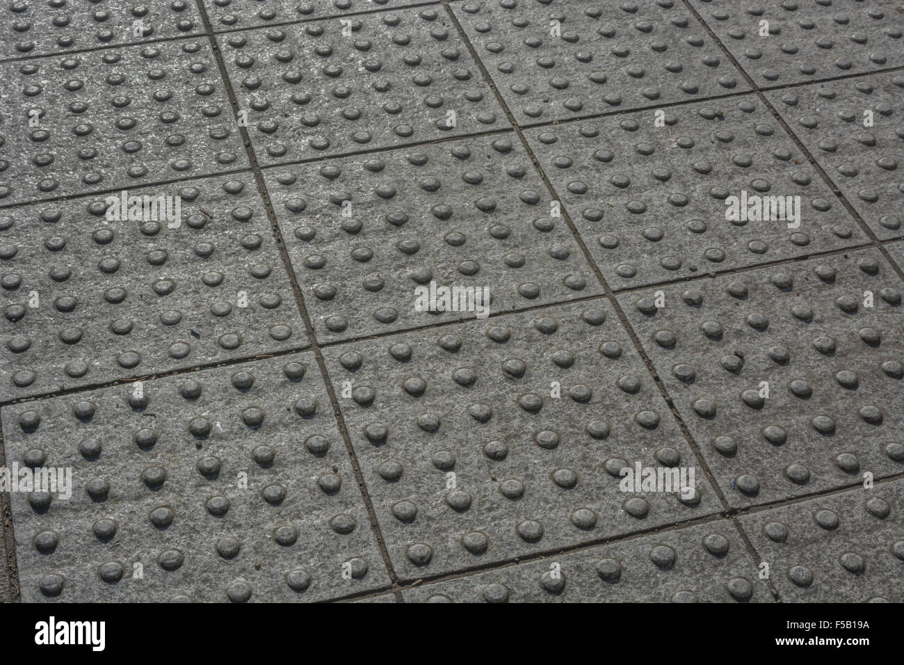 Square granite pavement segments in Cambourne, Cornwall. Metaphor high ...