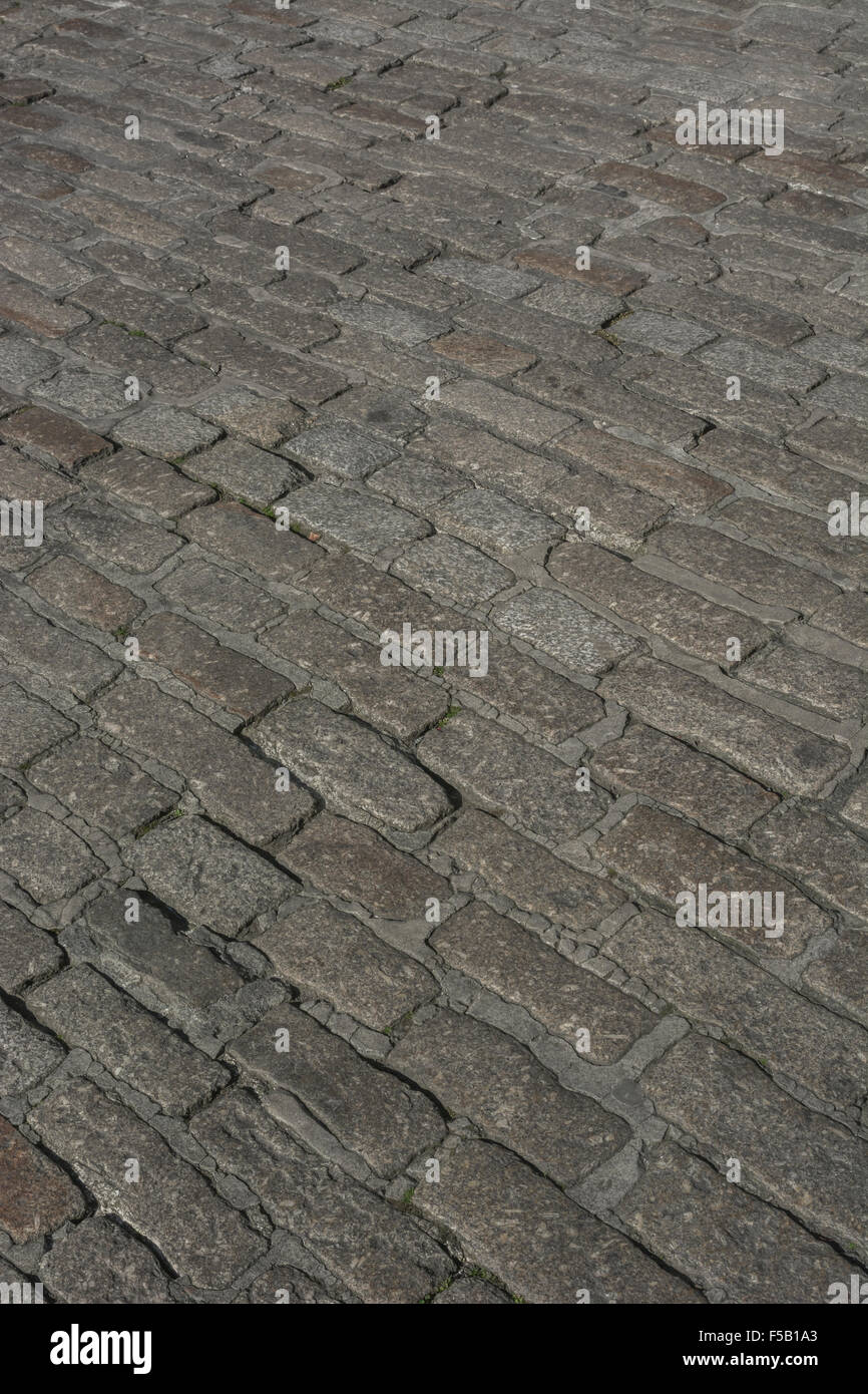 Cobblestone street surface in Truro, Cornwall. Granite stones ...