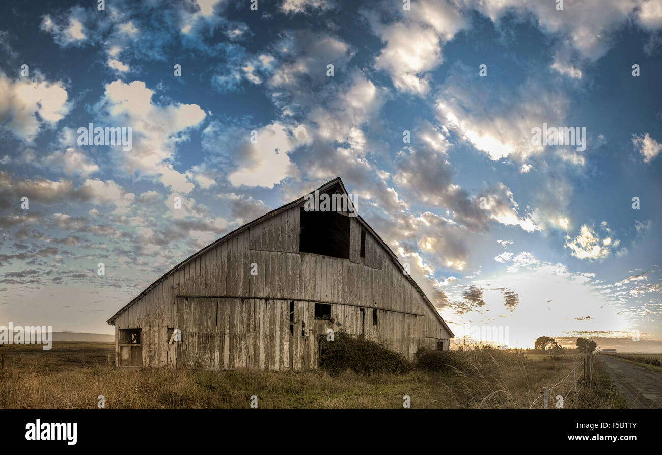 A panoramic color image of an old barn at sunset Stock Photo - Alamy
