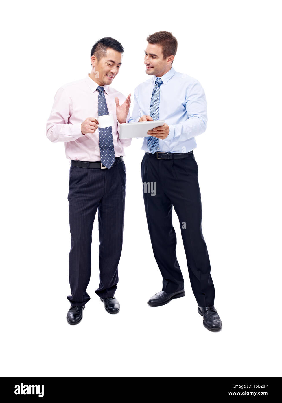 Two workers having conversation Cut Out Stock Images & Pictures - Alamy
