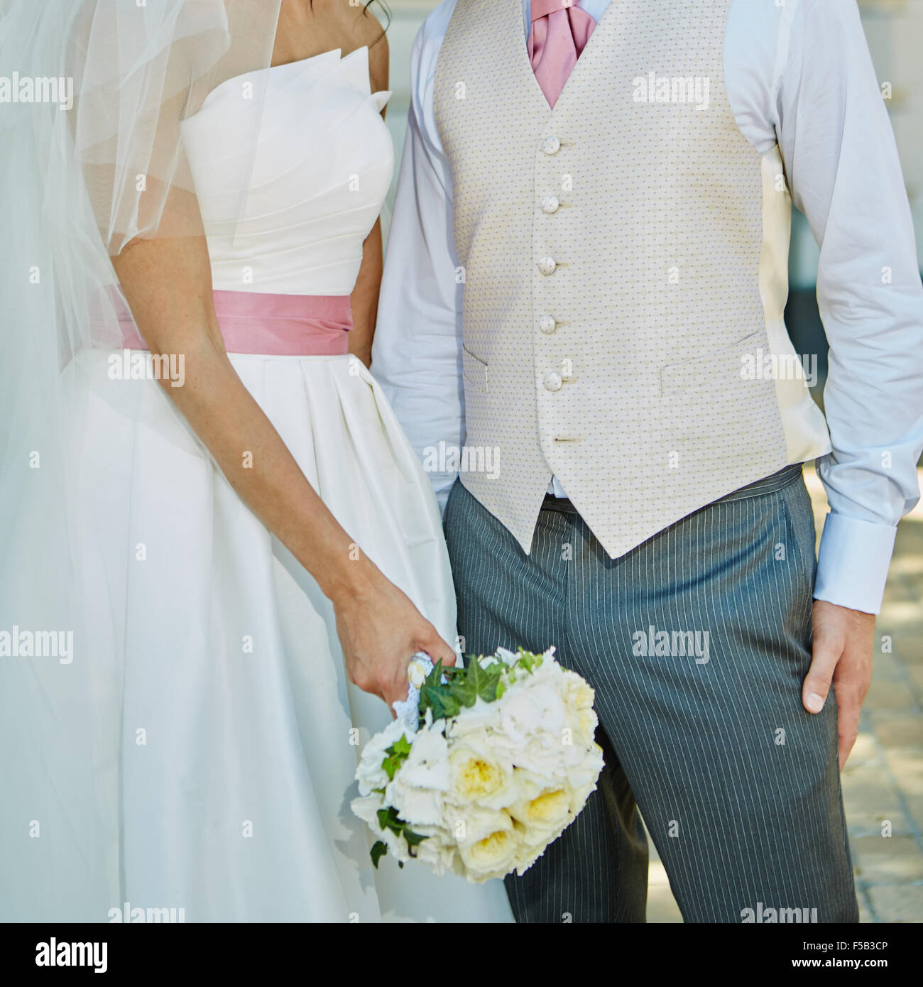 Elegant bride and groom posing together Stock Photo - Alamy