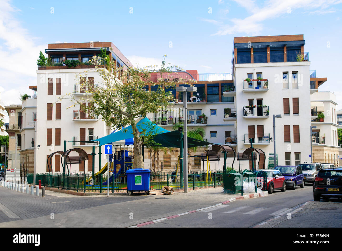 A new Apartment building in Jaffa Israel with a public playground in ...