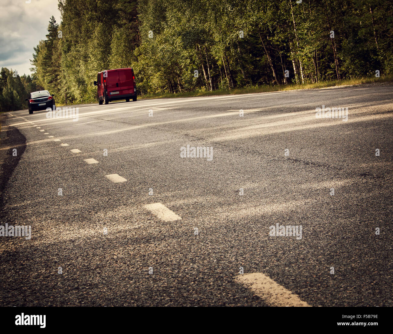 Asphalt road and dividing lines Stock Photo - Alamy