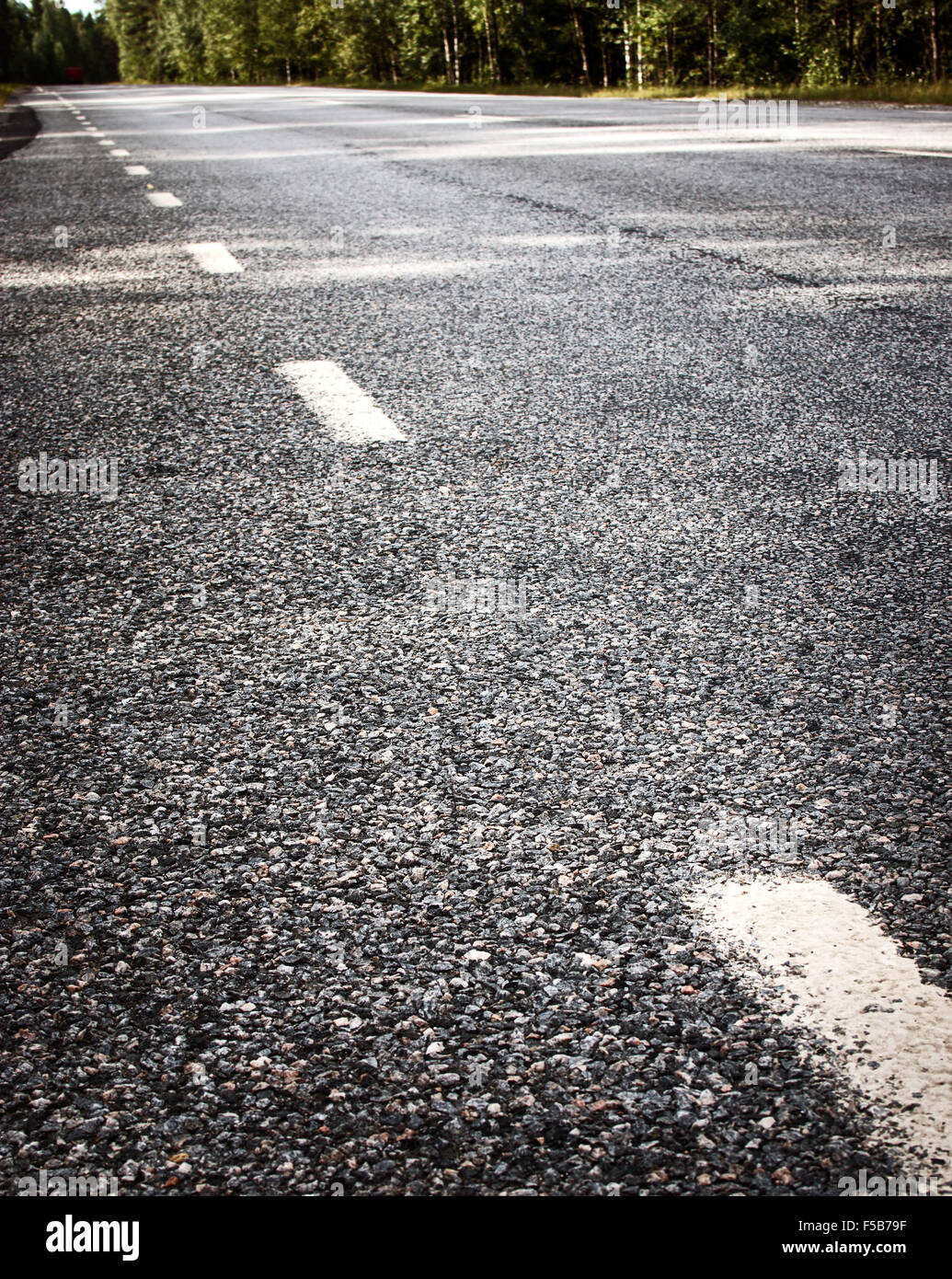 Asphalt road and dividing lines Stock Photo - Alamy