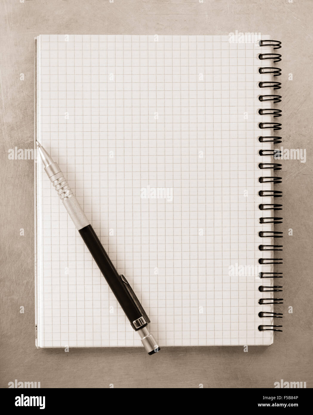 checked notebook at metal background texture Stock Photo - Alamy