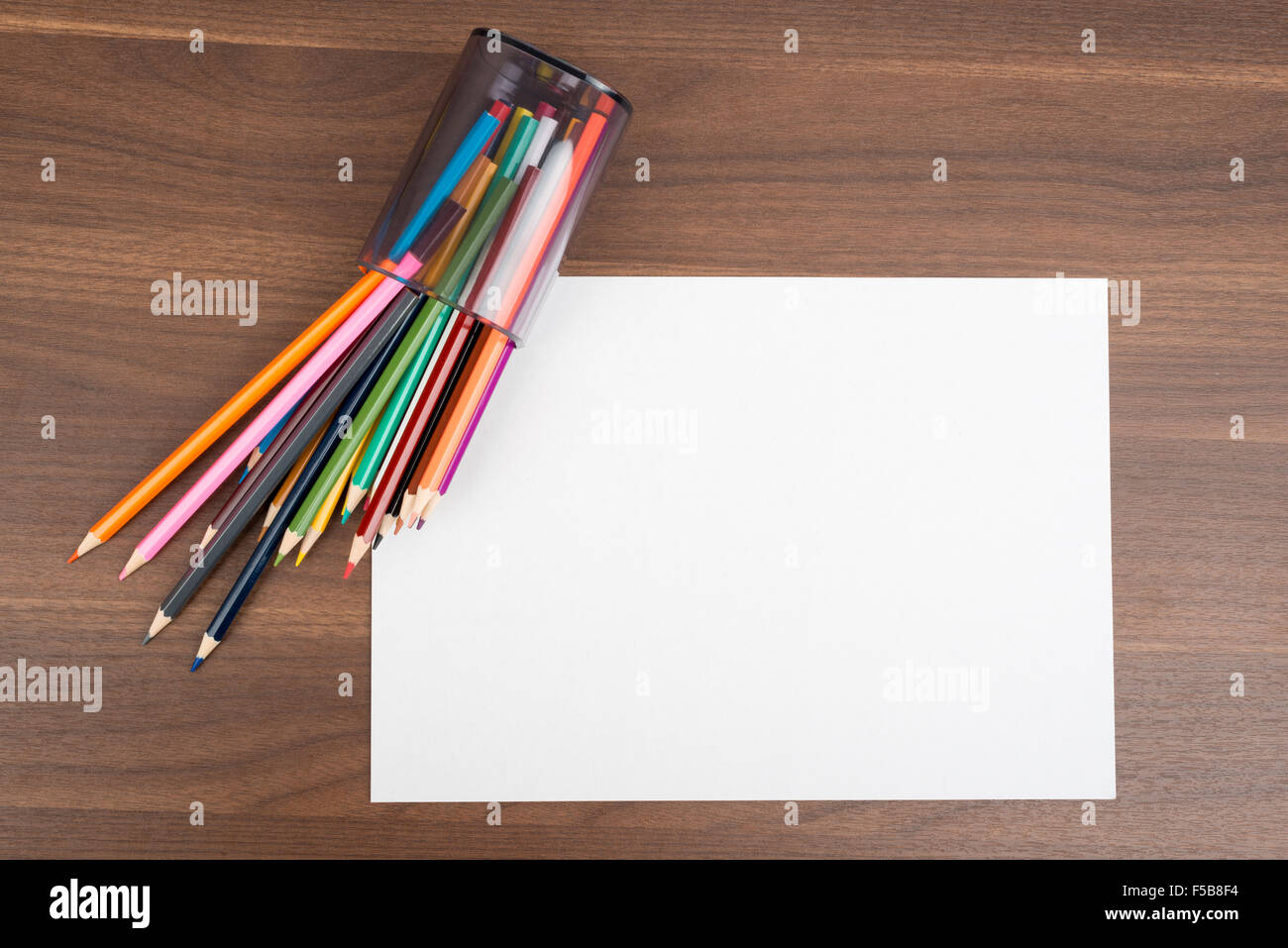 Blank paper with crayons Stock Photo - Alamy