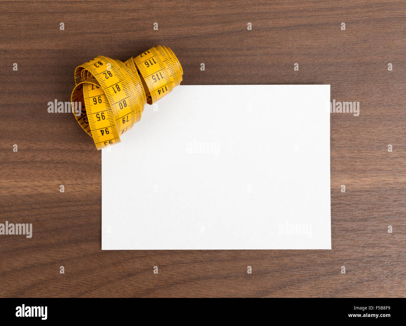 Blank paper with tape-measure Stock Photo - Alamy