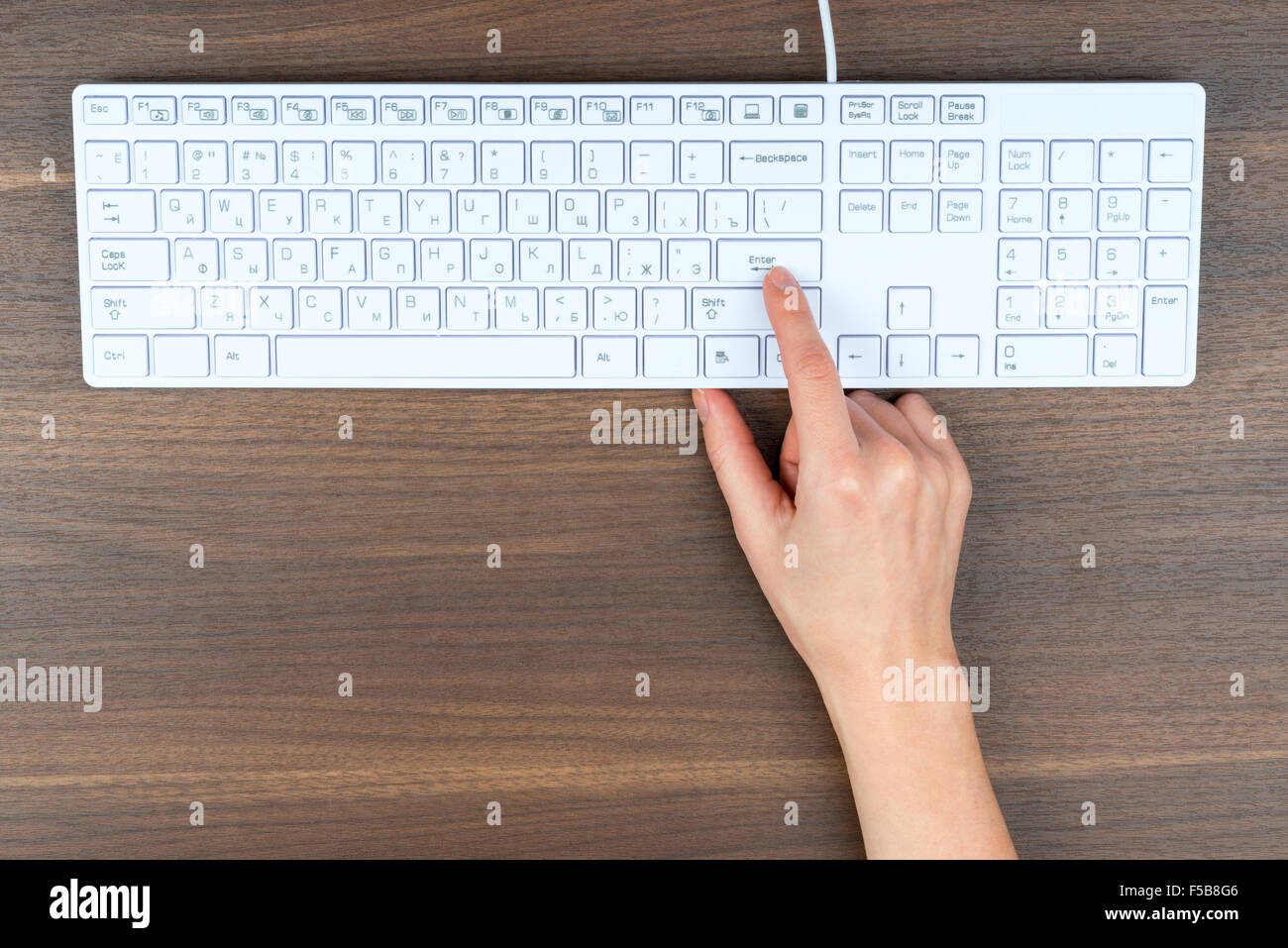 Humans hand with keyboard Stock Photo - Alamy