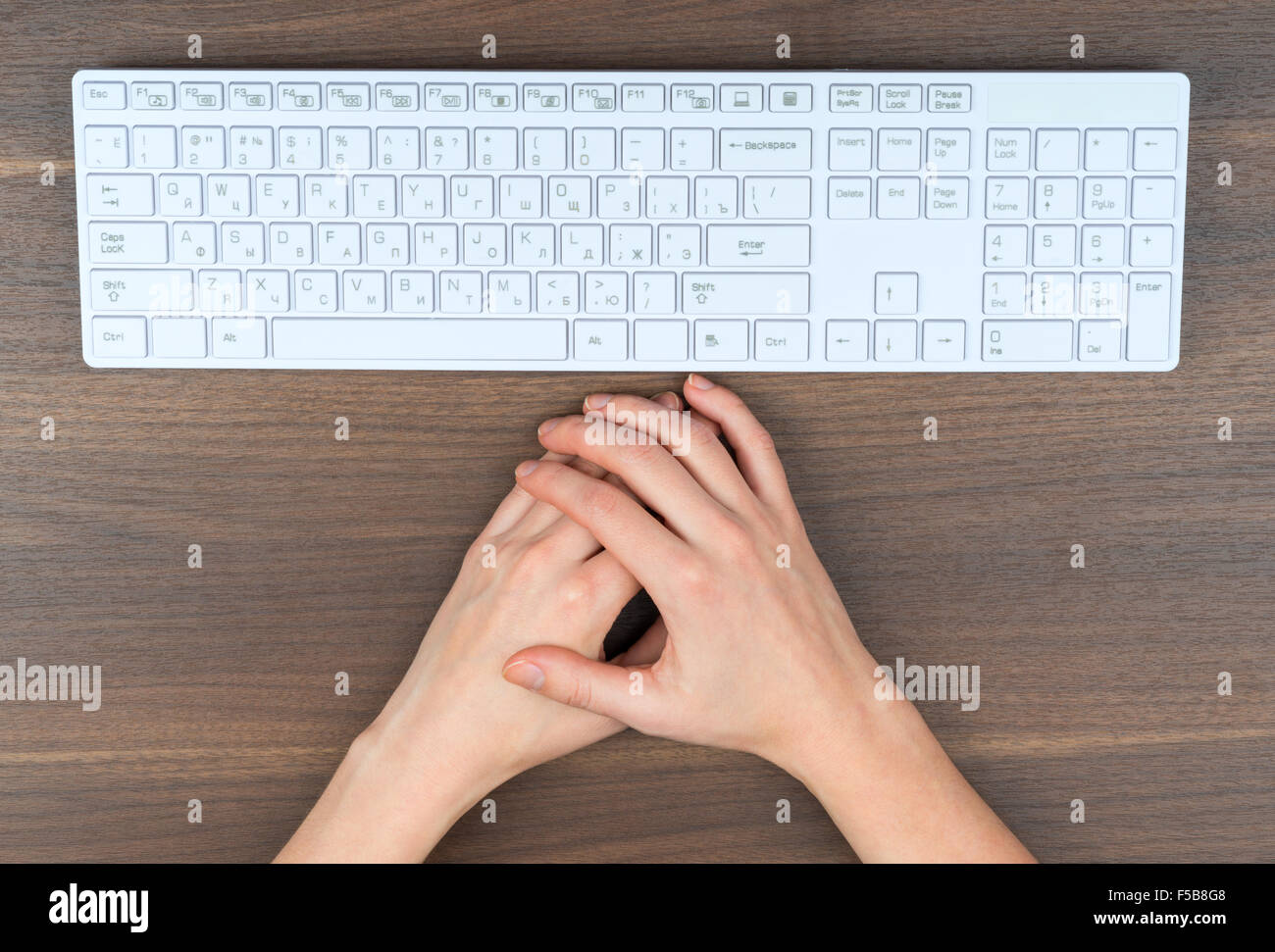 Humans hands with keyboard on table Stock Photo - Alamy