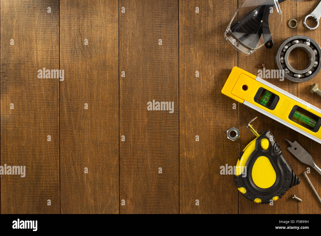 work tools and instruments on wooden background Stock Photo - Alamy