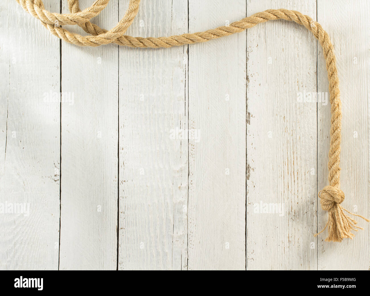 ship rope on wooden background Stock Photo - Alamy