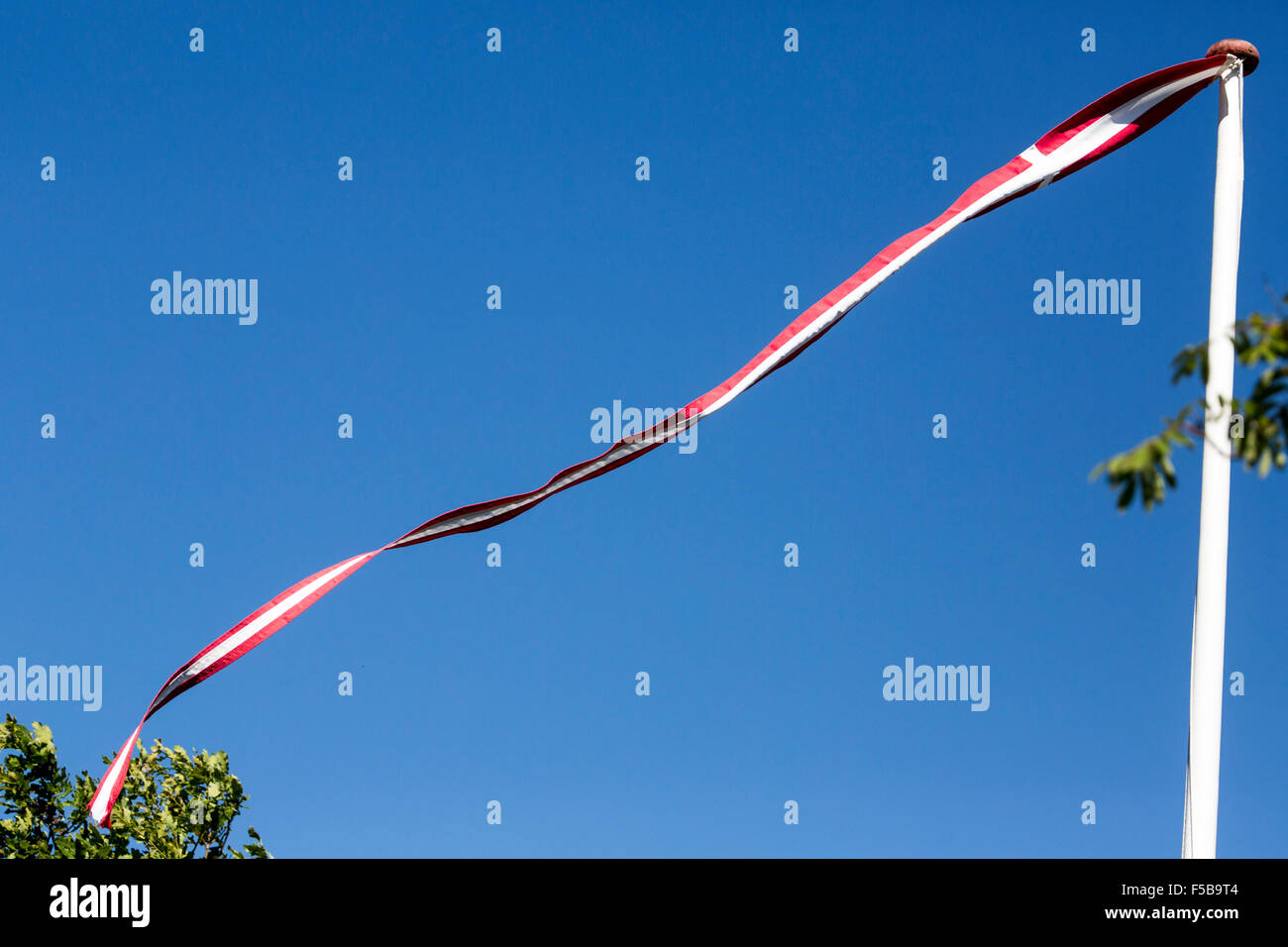 Danish pennant flag or vimpel flying against a clear blue sky Stock ...