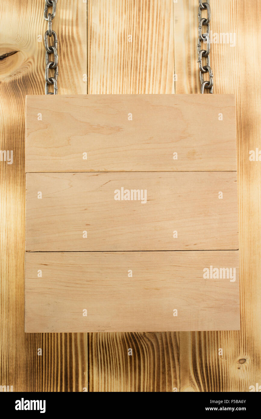 hanging signboard board on wooden background Stock Photo - Alamy