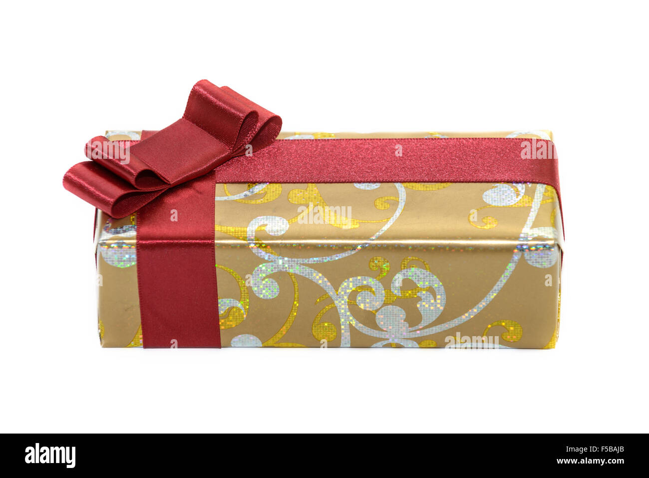 Wrapped gift with red ribbon and bow isolated on white background Stock ...