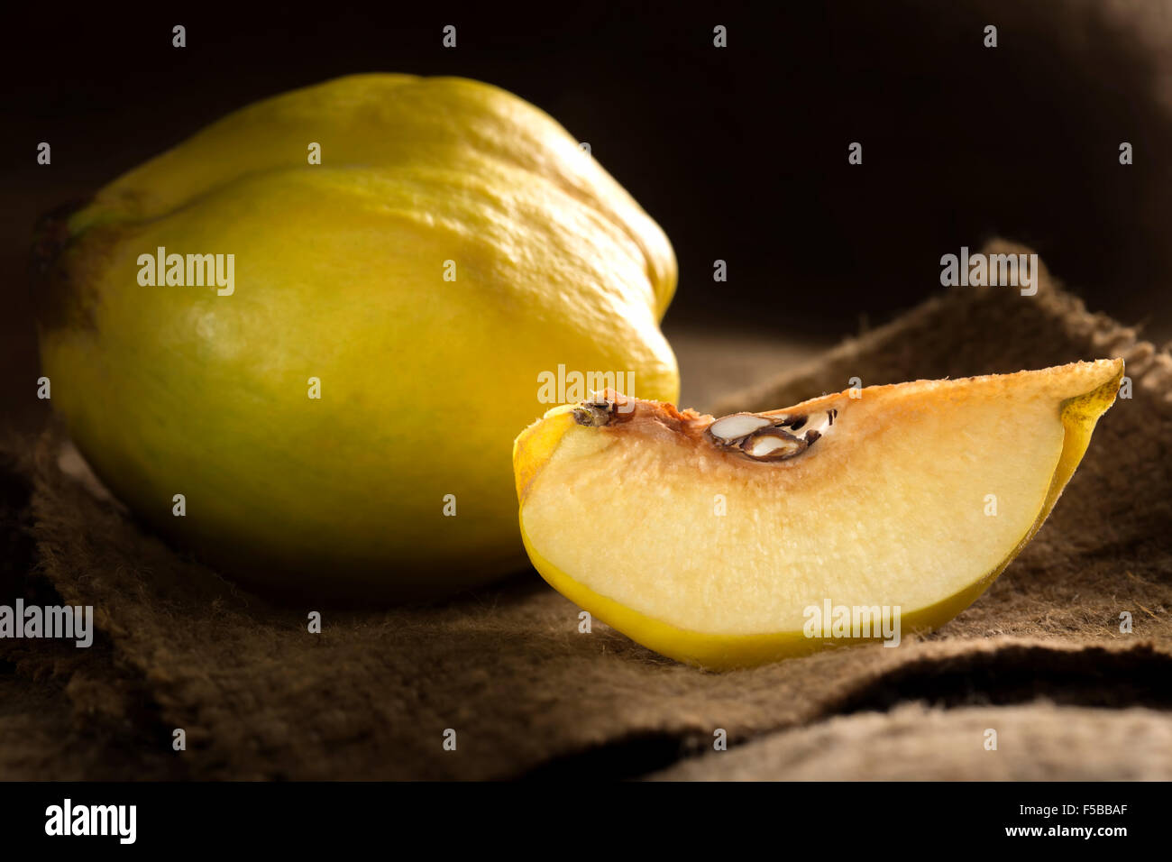 Natural ripe quince on a canvas bag background Stock Photo - Alamy