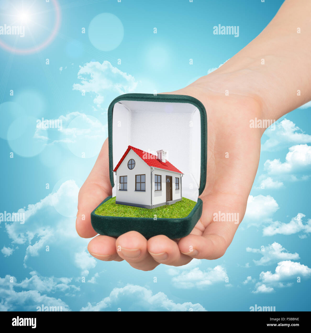 Empty ring box with house in womans hand Stock Photo - Alamy