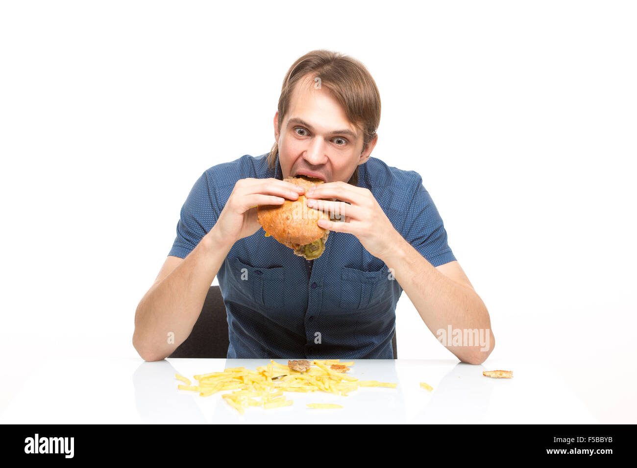 Hungry man eating big hamburger hi-res stock photography and images - Alamy