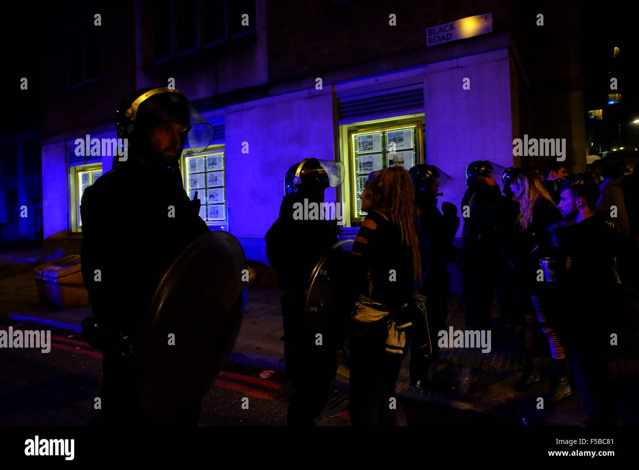 Riot police block road in Lambeth outside illegal Halloween rave Stock ...