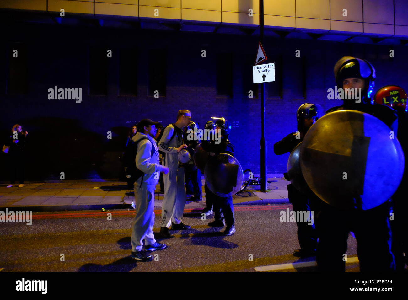Riot police block road in Lambeth outside illegal Halloween rave Stock ...