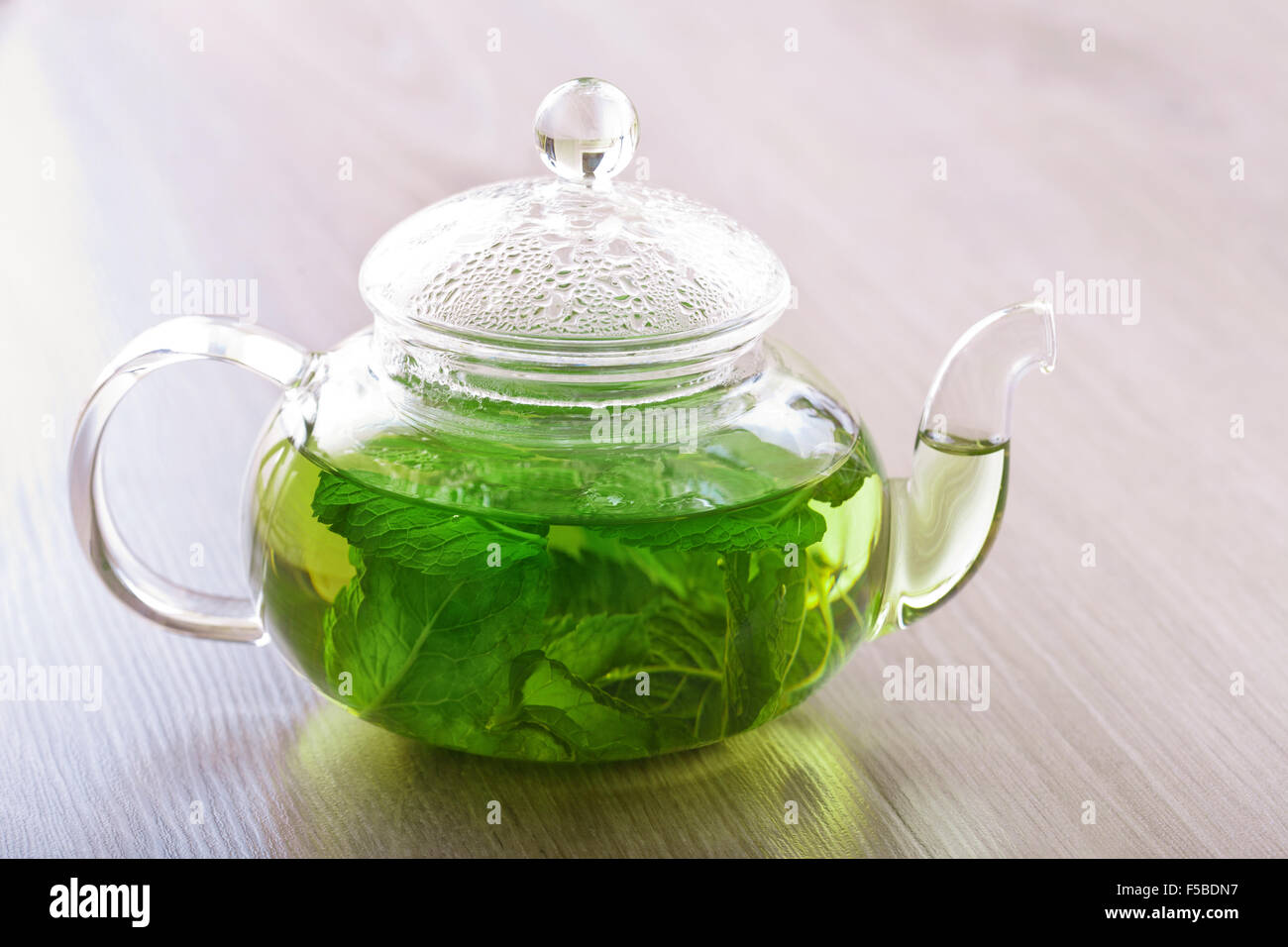 Peppermint tea in glass pot on the table Stock Photo - Alamy