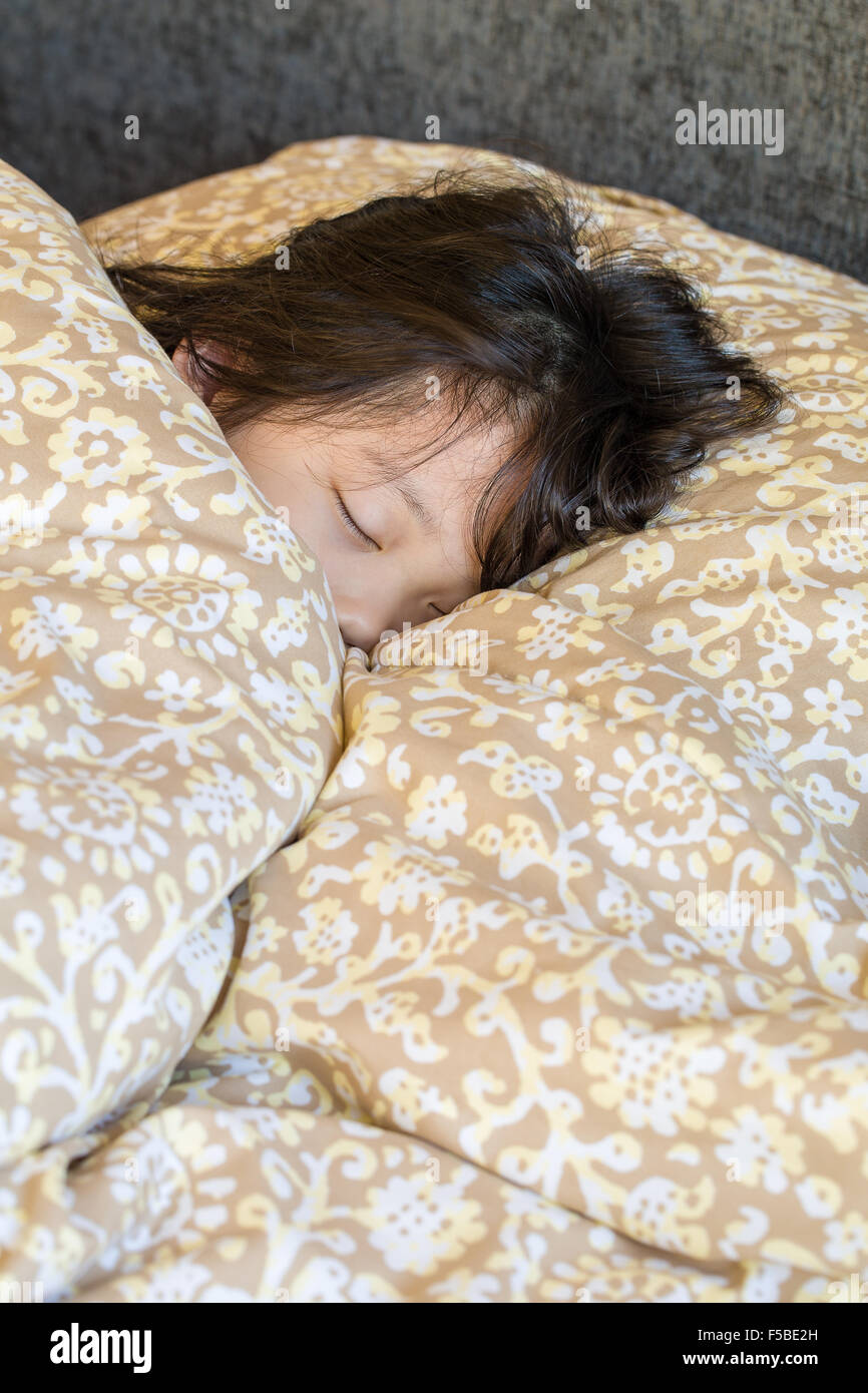 Asian child sleeping in cozy bed in morning Stock Photo - Alamy