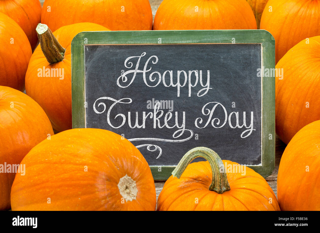 Happy Turkey Day - white chalk handwriting on a vintage slate ...