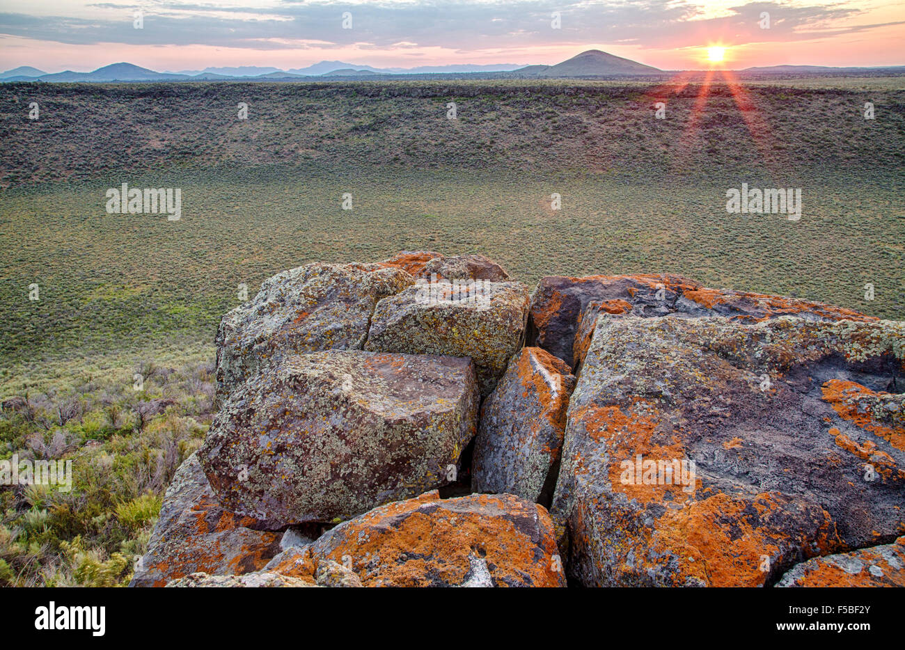 Sunrise over the remnants of a volcanic cone in the Craters of the Moon ...