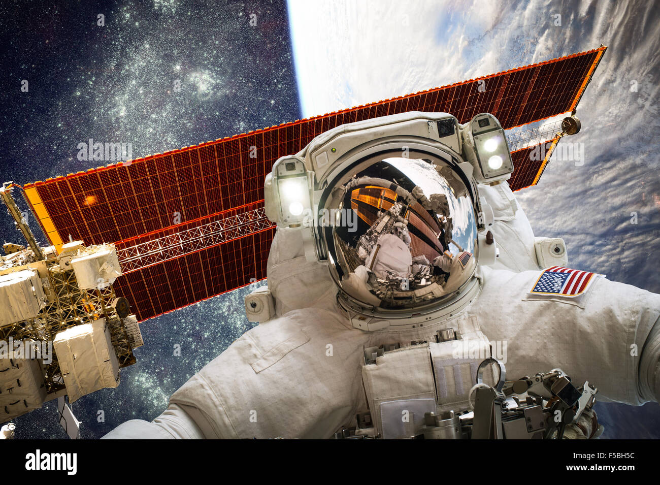 Astronaut in outer space against the backdrop of the planet earth ...