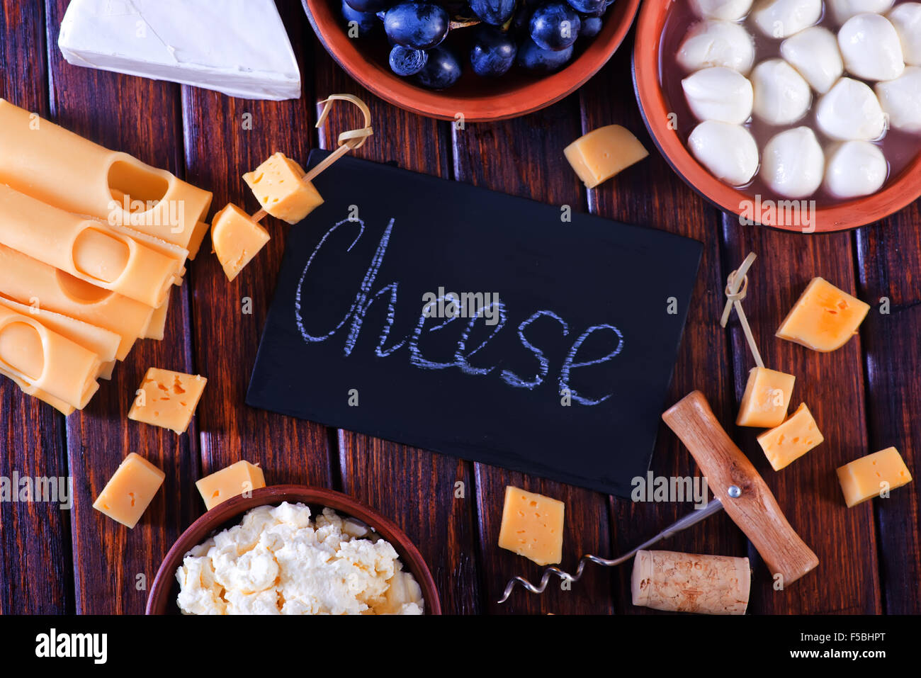 cheese in bowl and on the board Stock Photo - Alamy