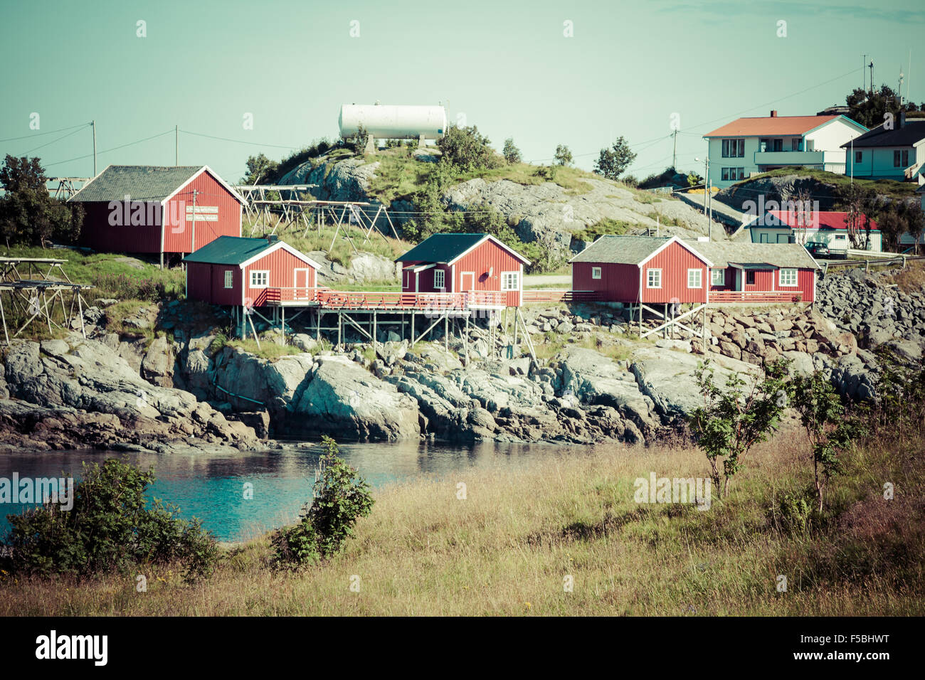Typical Norwegian fishing village with traditional red rorbu huts ...