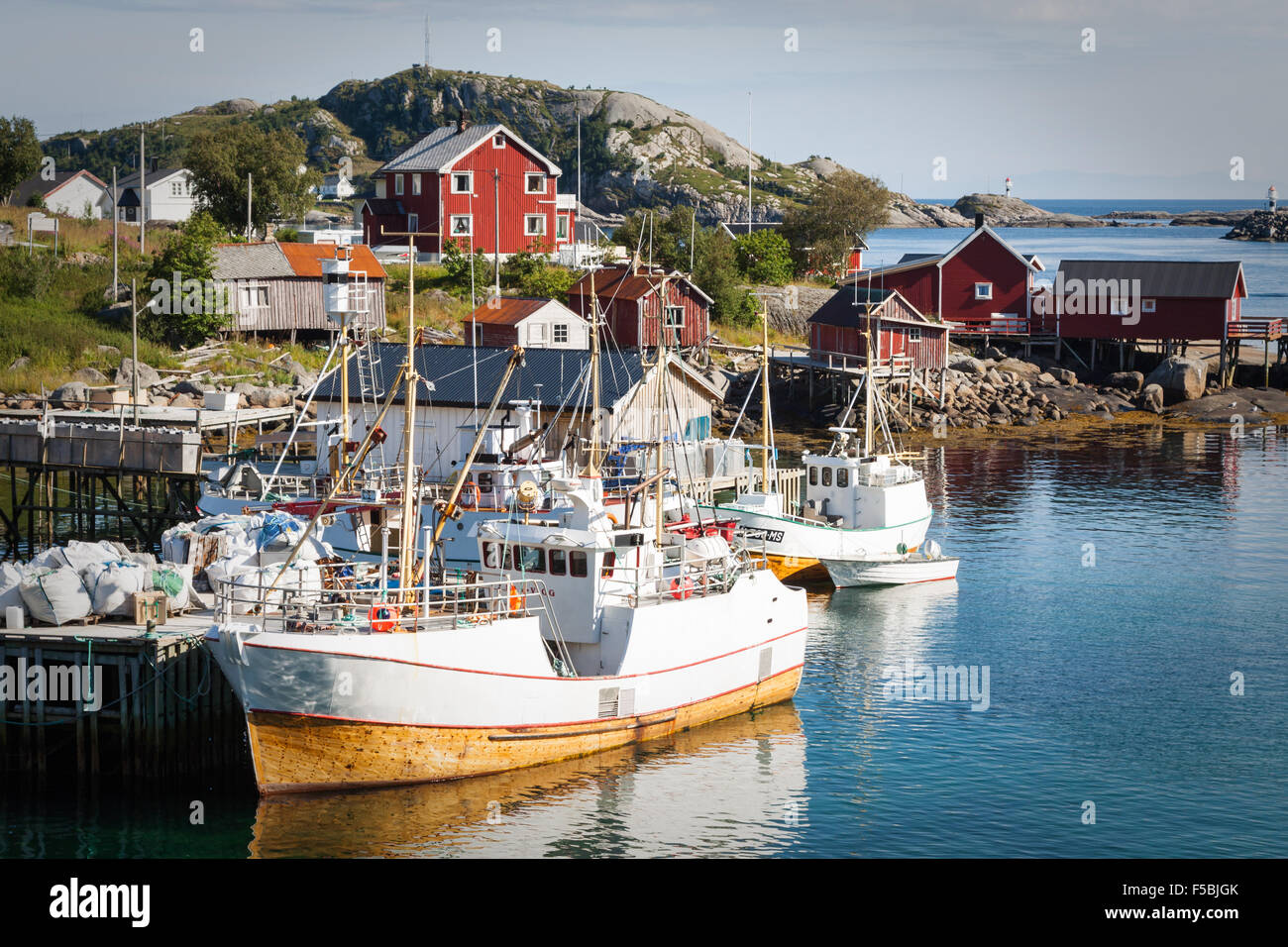 Typical Norwegian fishing village with traditional red rorbu huts ...