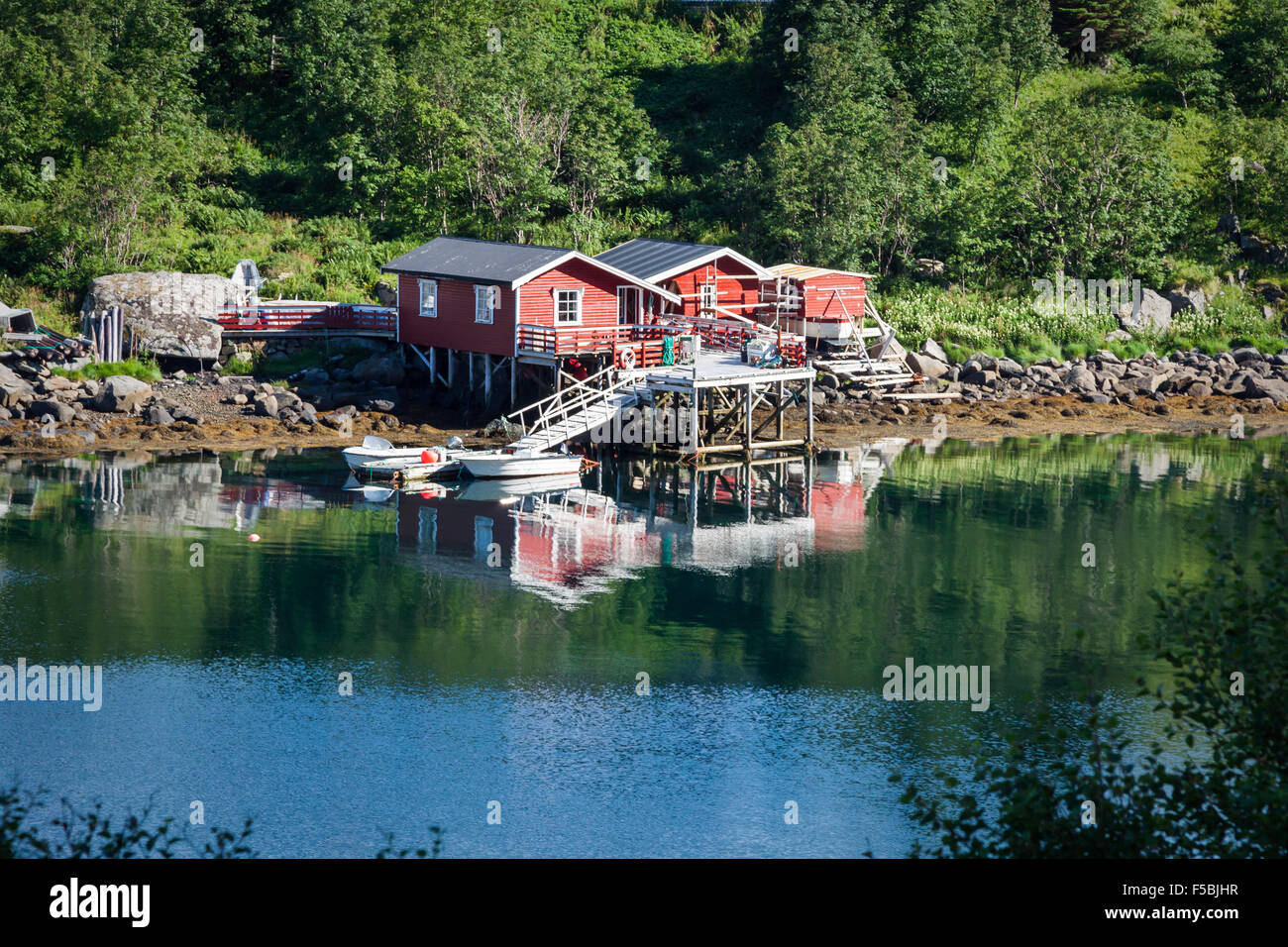 Typical Norwegian fishing village with traditional red rorbu huts ...