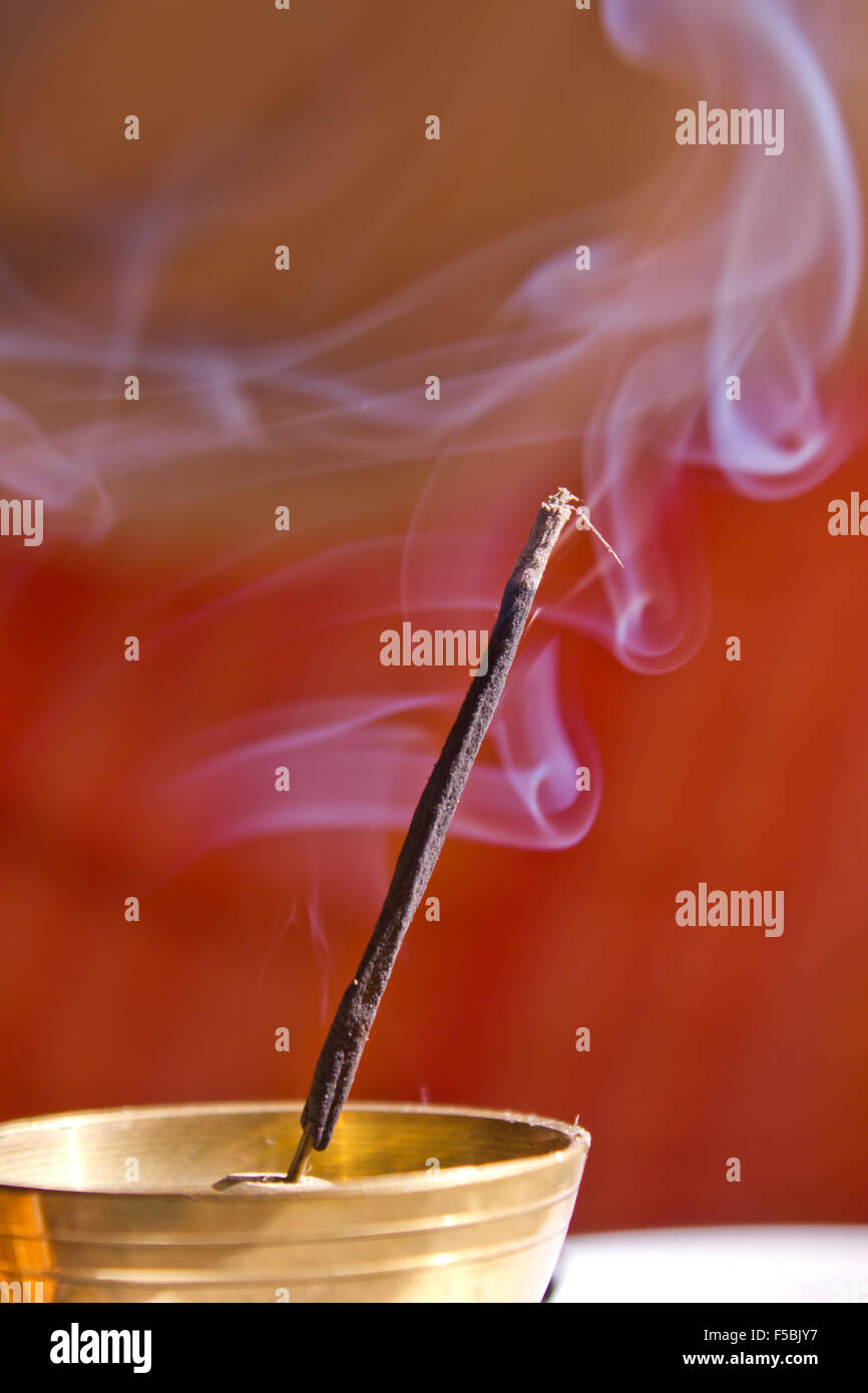 Fuming incense stick Stock Photo - Alamy