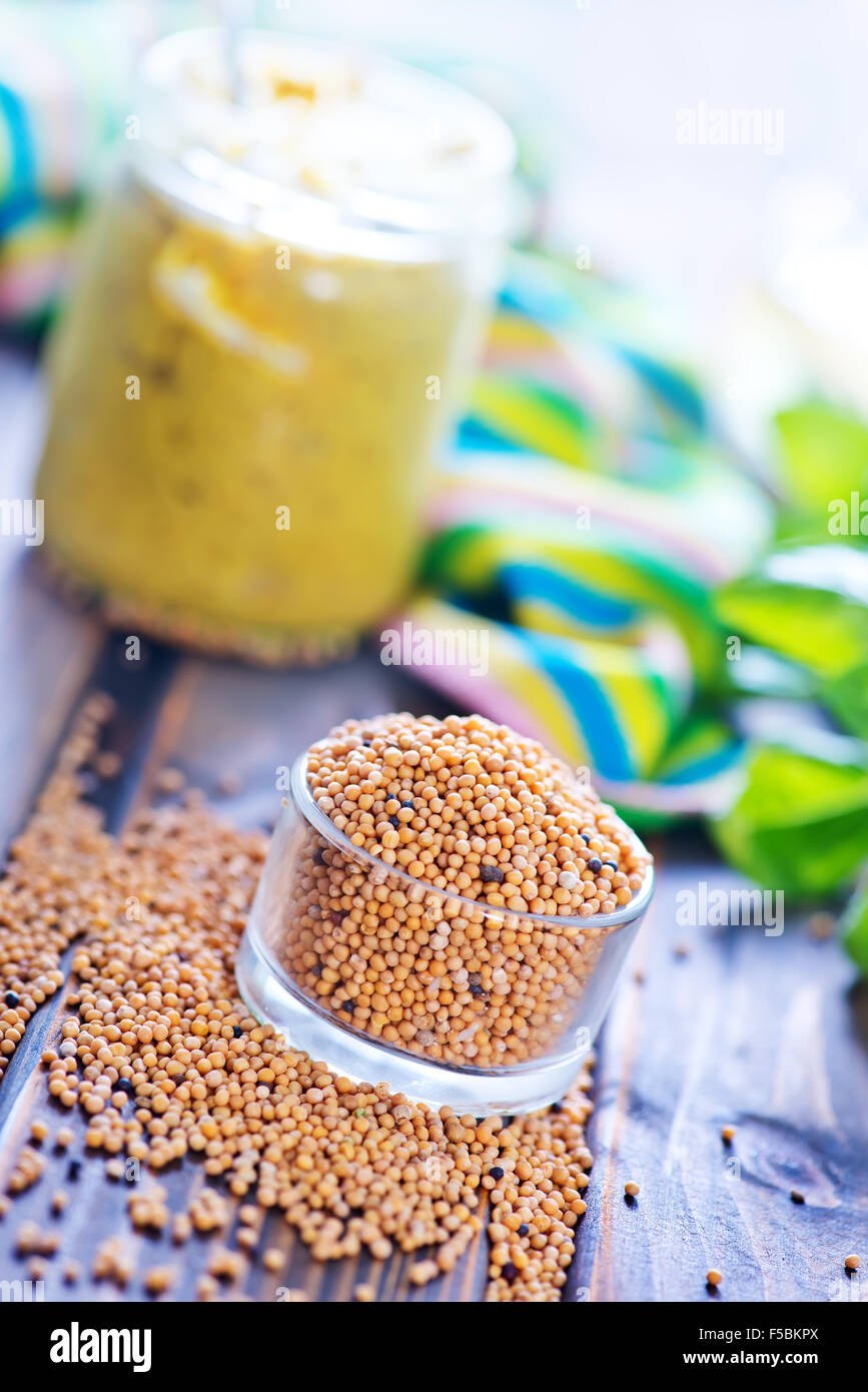 mustard in glass bank and on a table Stock Photo - Alamy