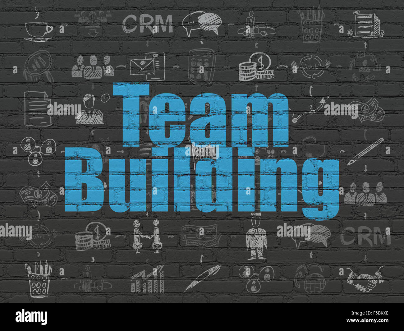 Finance concept: Team Building on wall background Stock Photo - Alamy