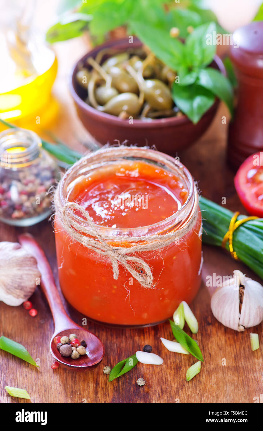 salsa in glass bank and on a table Stock Photo - Alamy