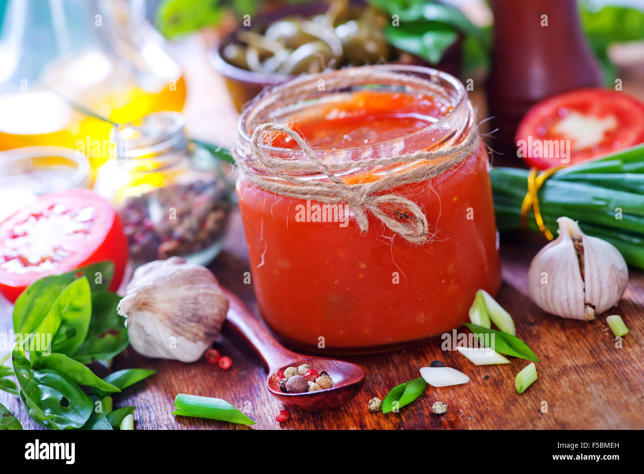 salsa in glass bank and on a table Stock Photo - Alamy