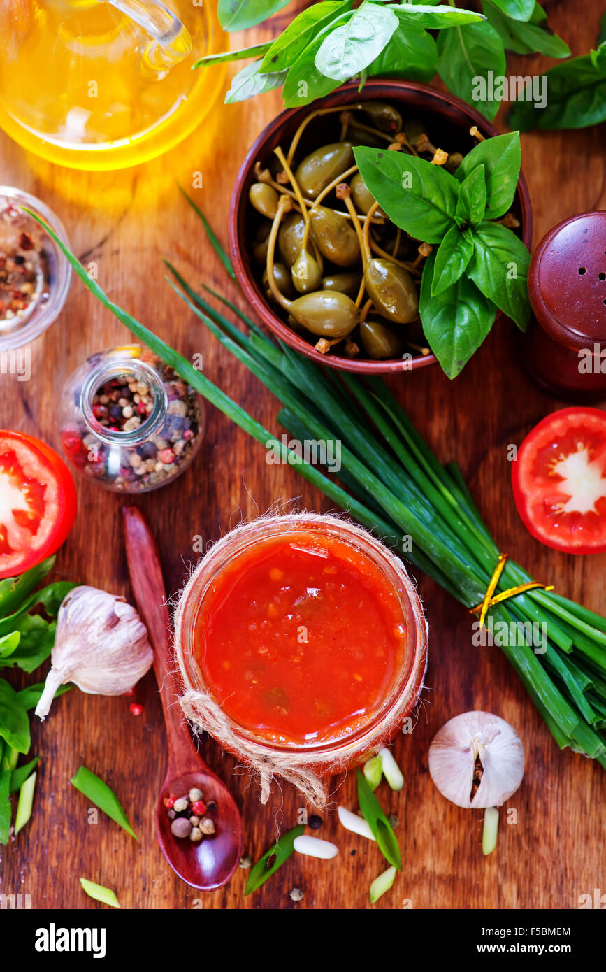 salsa in glass bank and on a table Stock Photo - Alamy