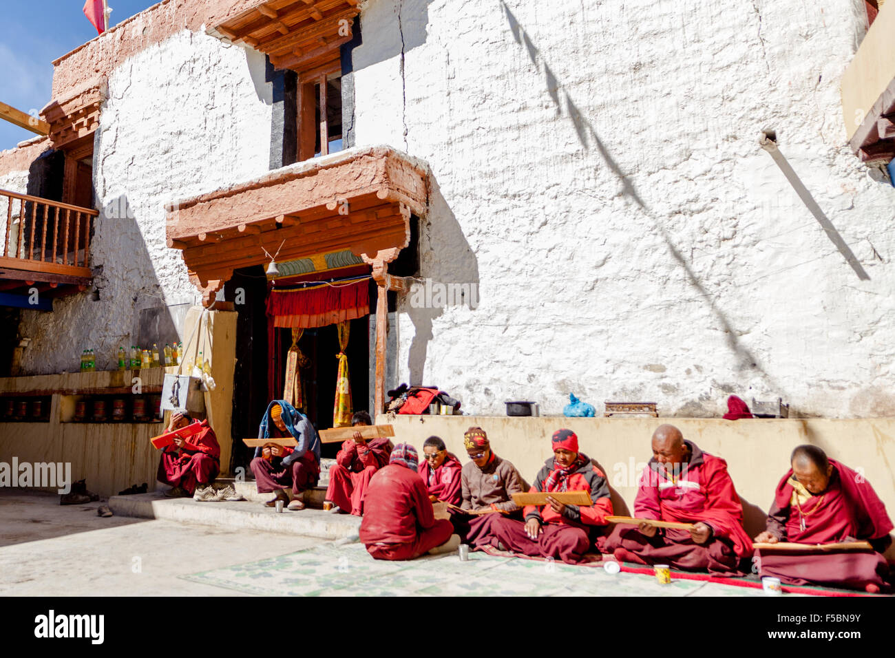 Buddhist monks reading religious scrolls at the courtyard of the Hanle ...