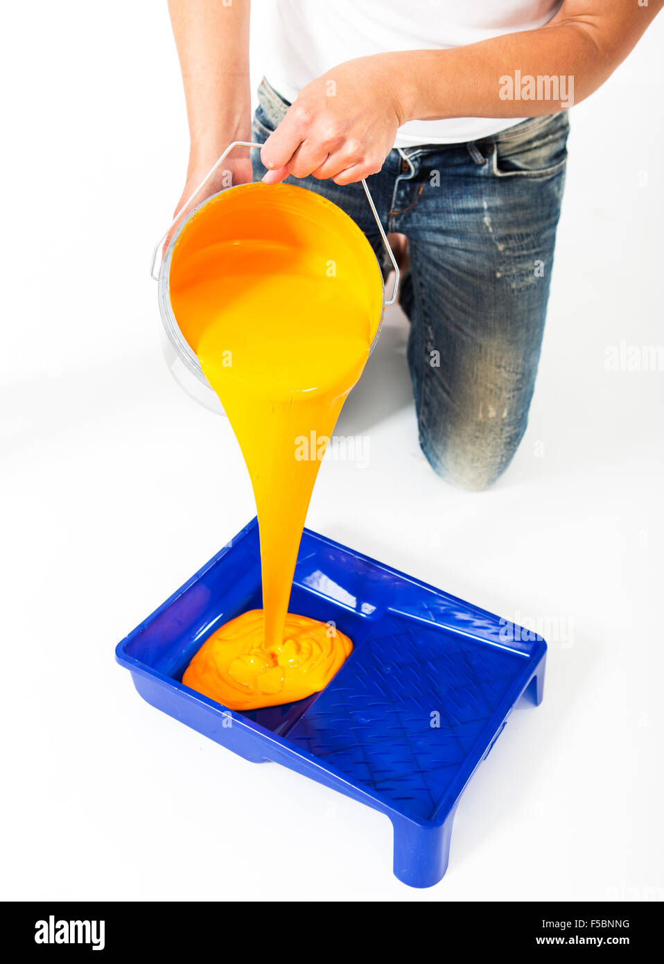 Pouring Paint Into A Bucket