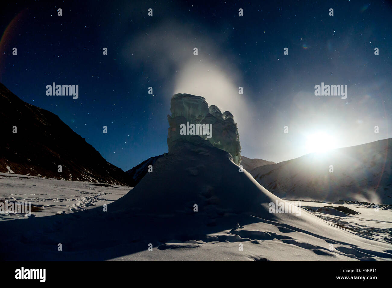 The frozen hot spring geyser at Puga in a starry moonlit night Stock ...