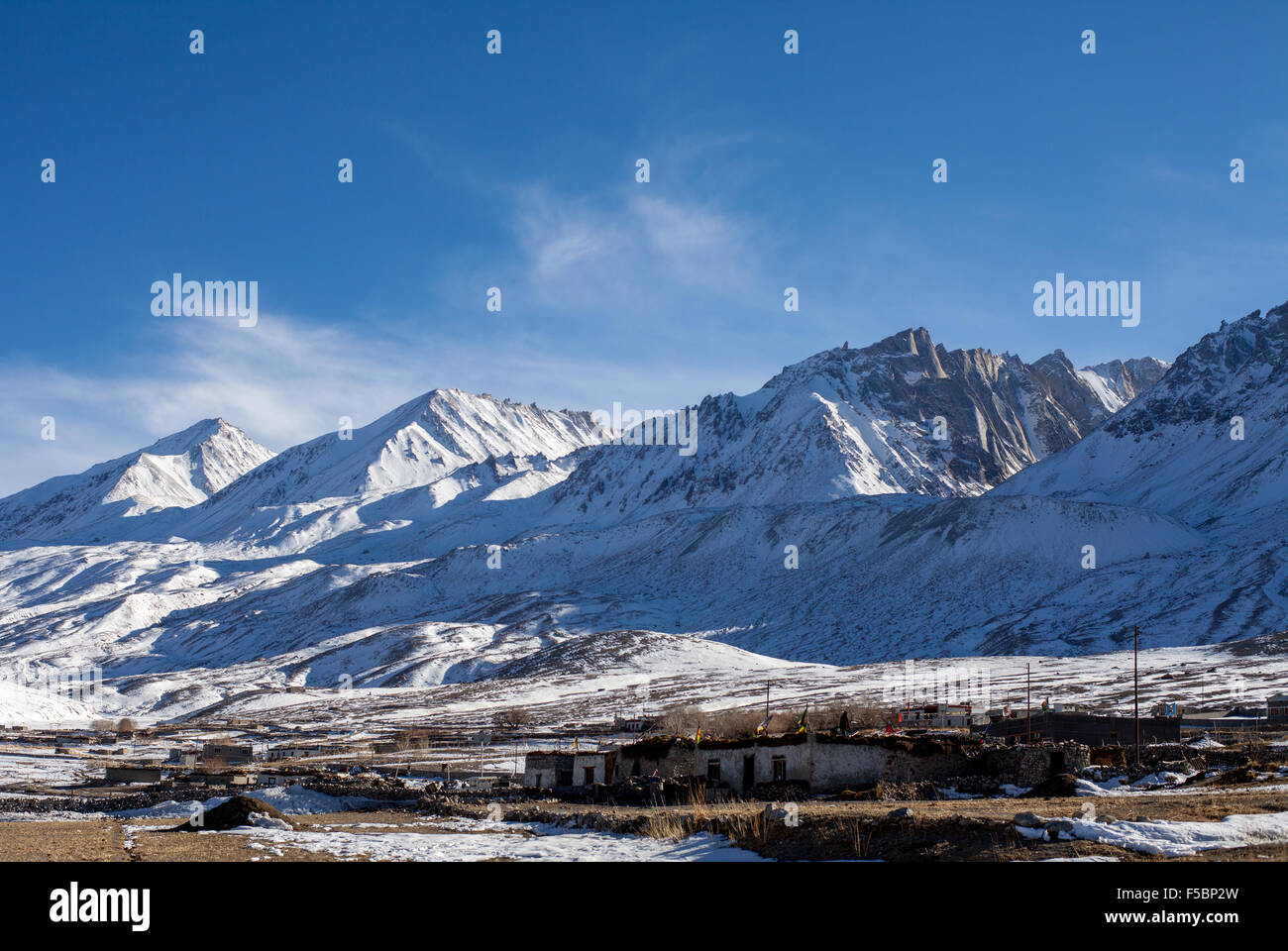 The Maan village in winter under the jagged peaks of the snow covered ...